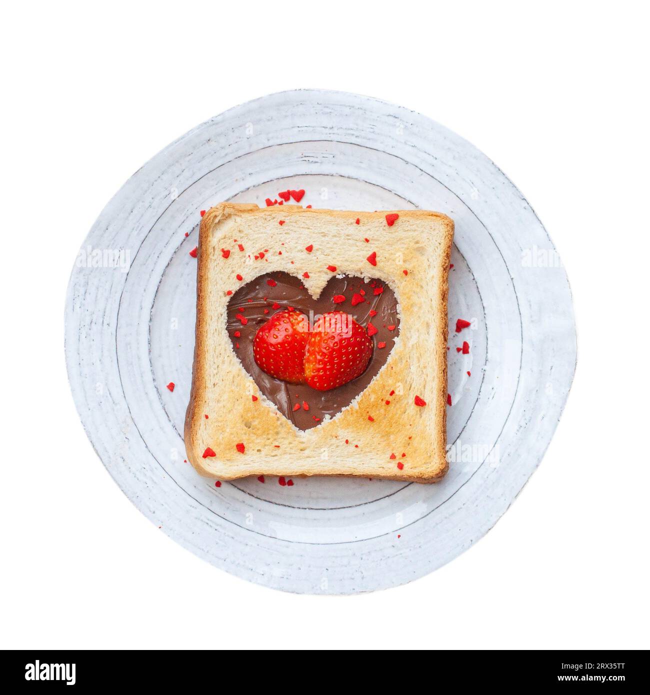 Toast with heart shaped chocolate spread, fresh strawberries and ...