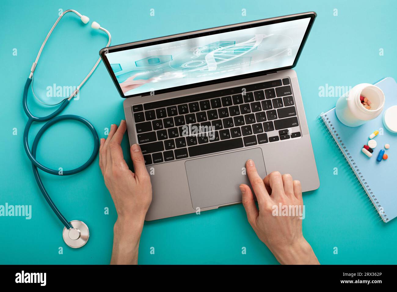 doctor's hand is typing the data into the system. Using a laptop ...