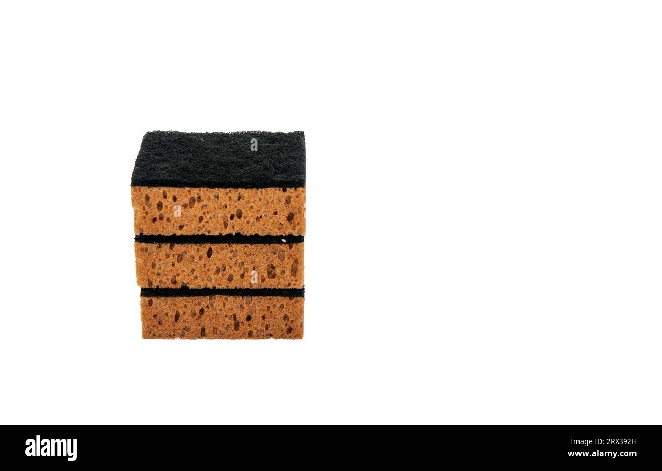 Black and brown sponge for washing dishes on a white background ...