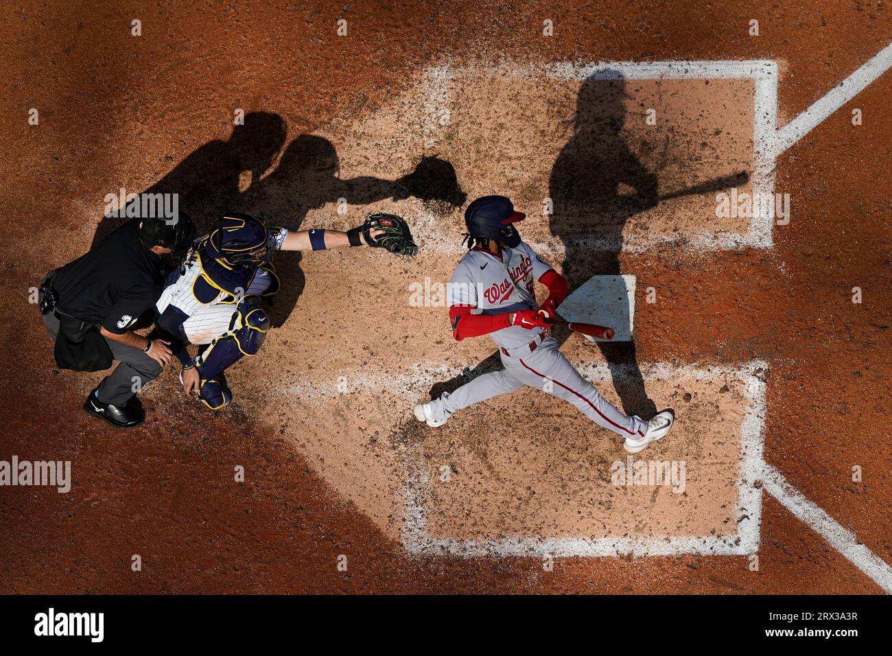 Washington Nationals' CJ Abrams hits into a double play during the ...