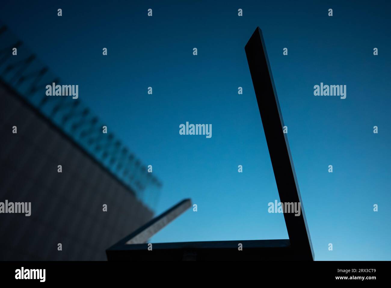 abstract metal geometric shape on blue evening sky background Stock ...