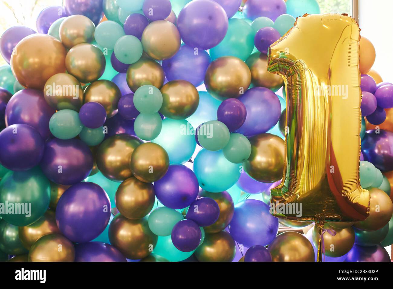 Background with many colorful balloons and number one shaped golden ...