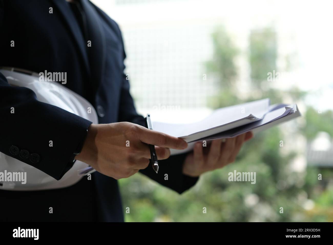 Male architect reading documents construction hi-res stock photography ...