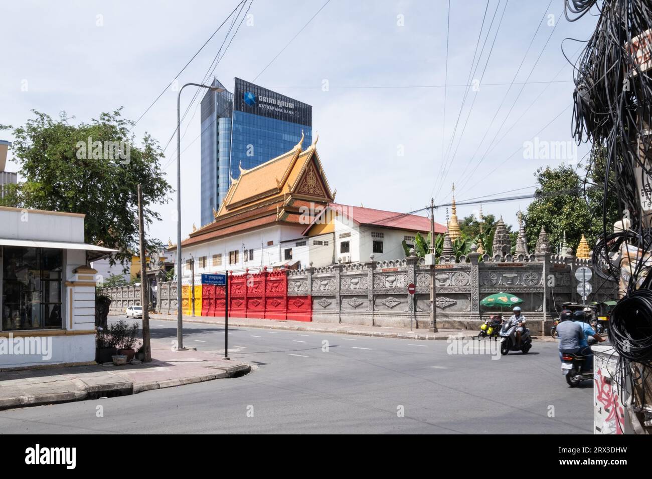Saravoan Techo Pagoda's wall part painted, with Sathapana Bank behind ...