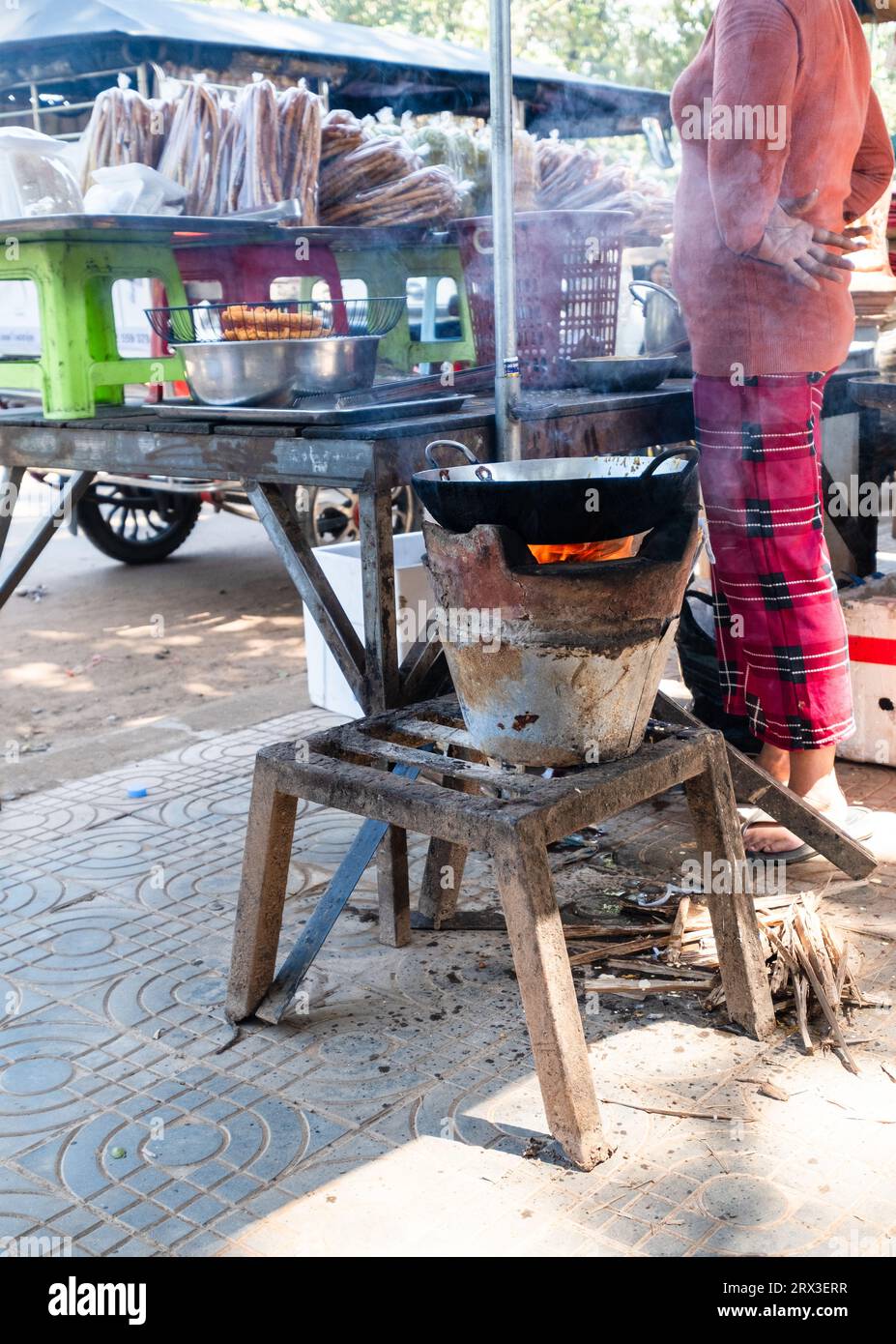 Clay bucket stove cooking food in a market at Phreah Reach Traop ...