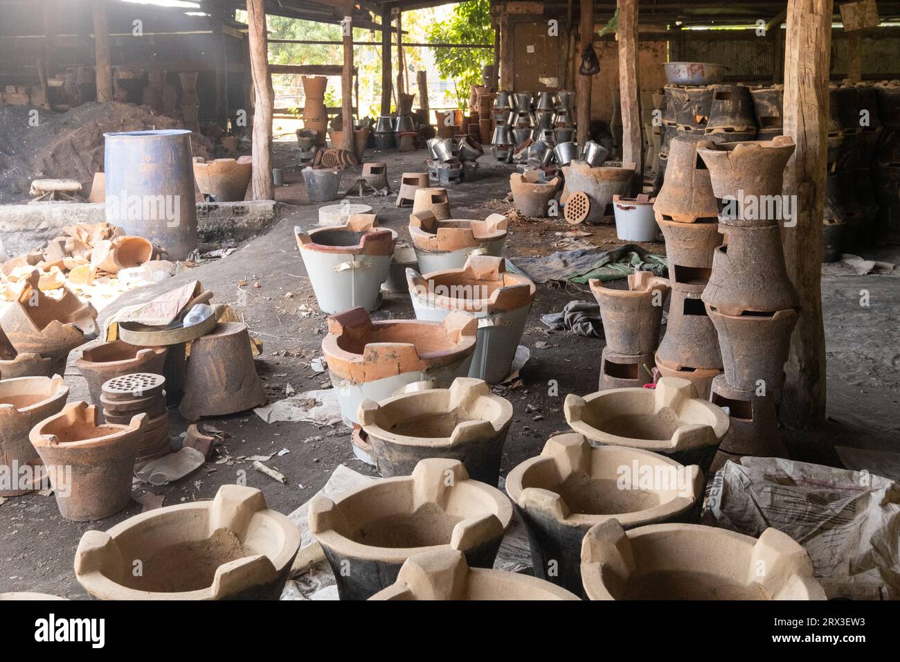 Clay bucket stoves being made by hand in Cambodia Stock Photo - Alamy