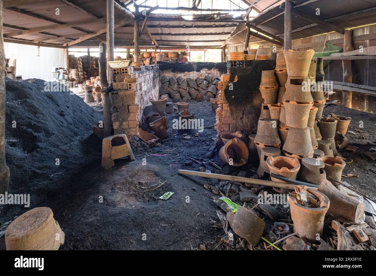 Clay bucket stoves being made by hand in Cambodia Stock Photo - Alamy