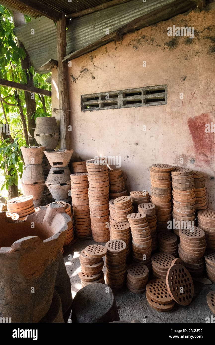 Clay bucket stoves being made by hand in Cambodia Stock Photo - Alamy