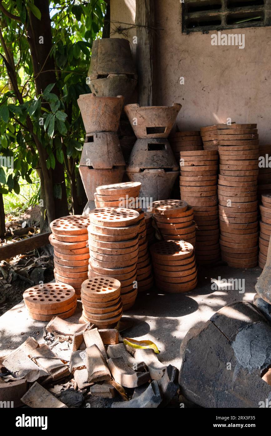 Clay bucket stoves being made by hand in Cambodia Stock Photo - Alamy