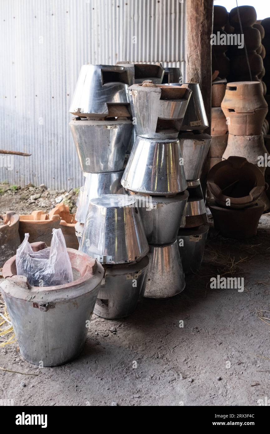 Clay bucket stoves being made by hand in Cambodia Stock Photo - Alamy