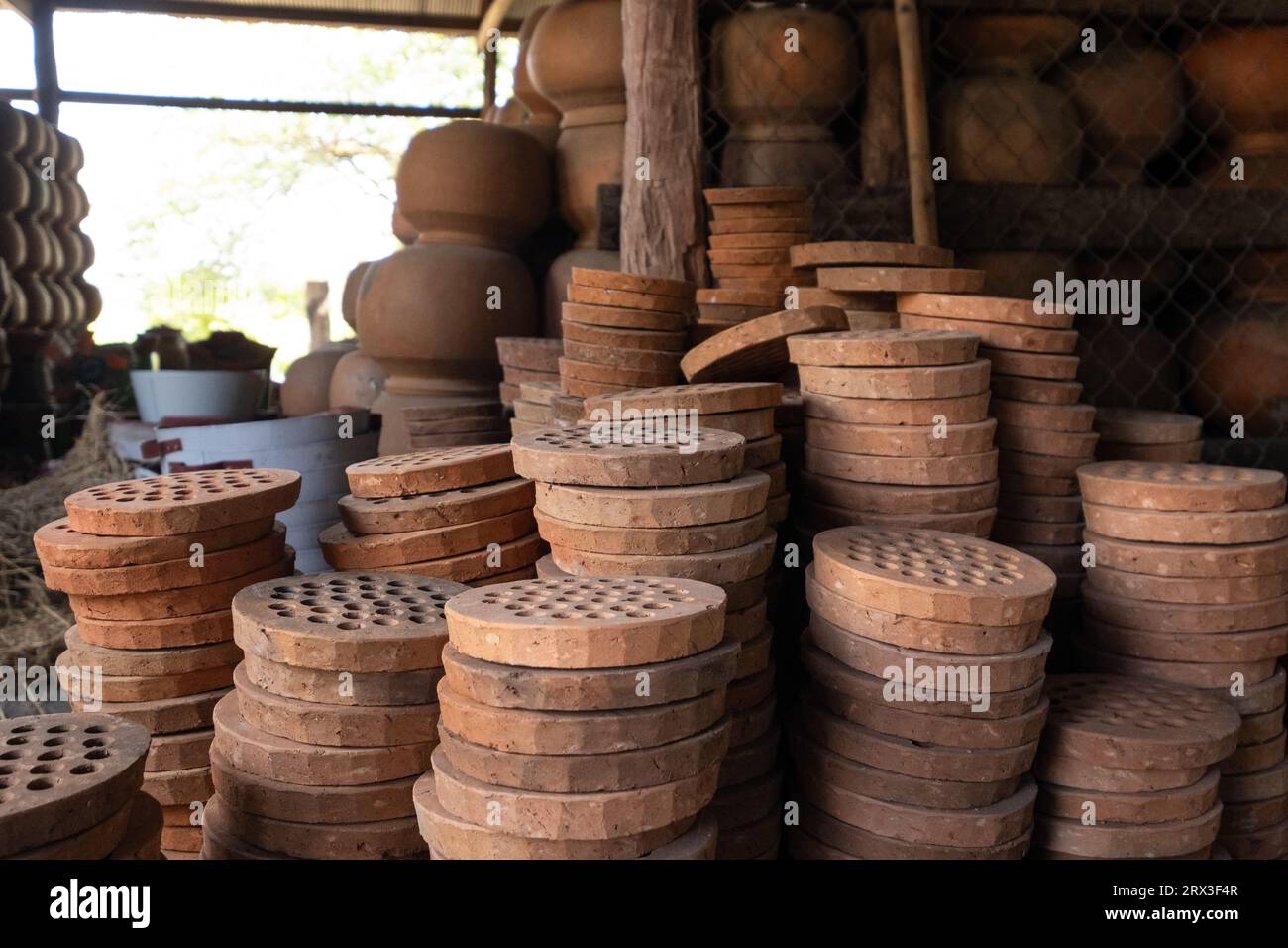 Clay bucket stoves being made by hand in Cambodia Stock Photo - Alamy