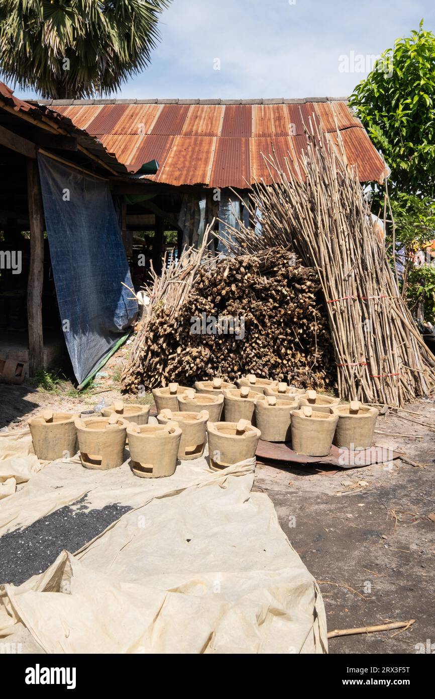 Clay bucket stoves being made by hand in Cambodia Stock Photo - Alamy