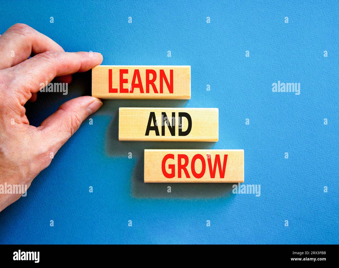 Learn and grow symbol. Concept word Learn And Grow on beautiful wooden ...