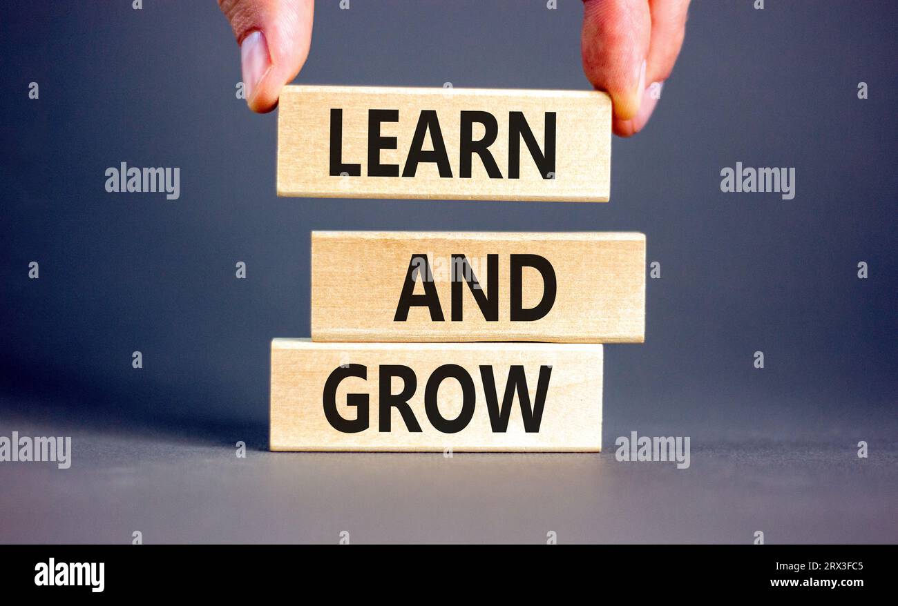 Learn and grow symbol. Concept word Learn And Grow on beautiful wooden ...