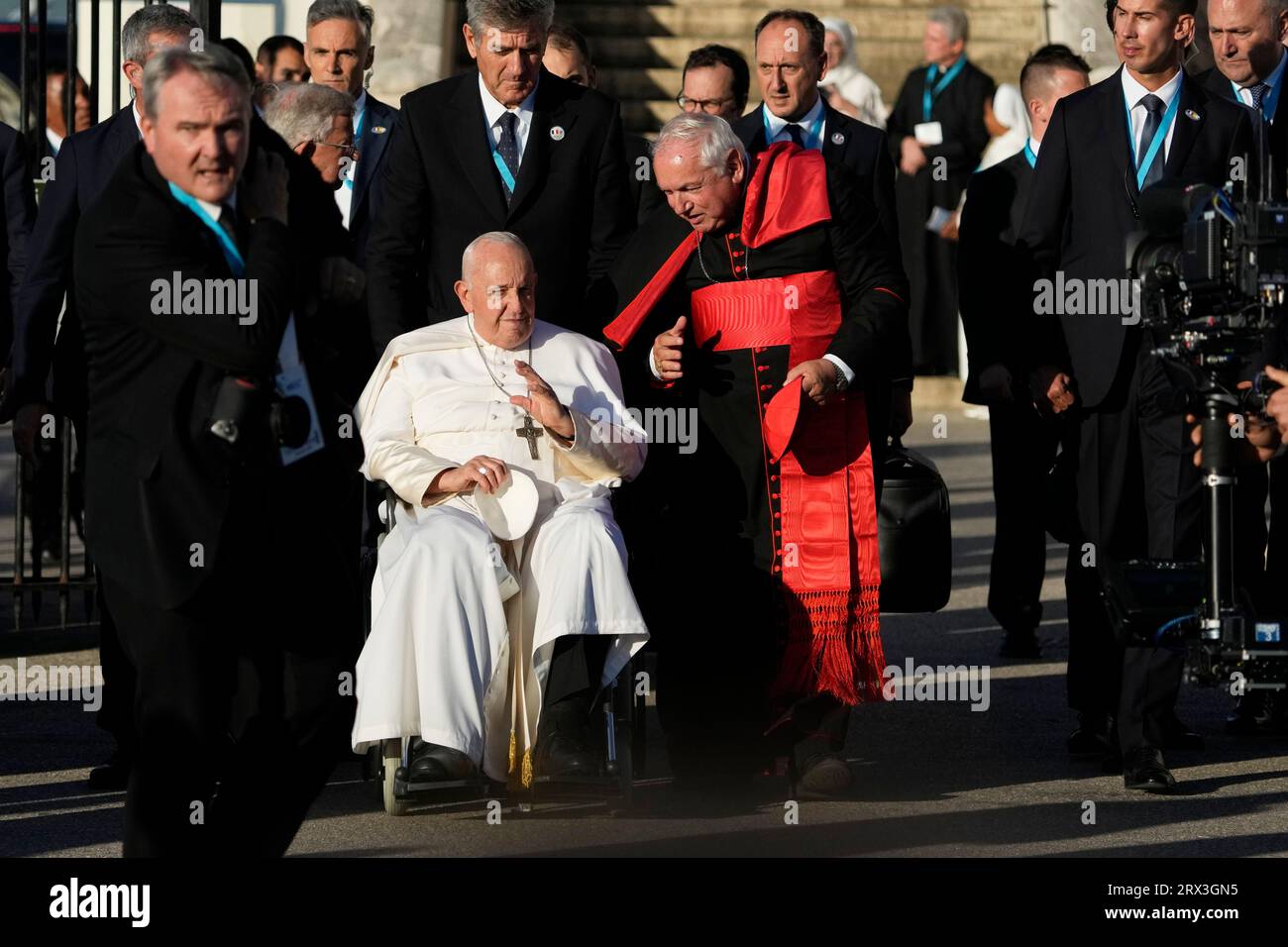 Pope Francis and Cardinal Jean Marc Aveline, centre right, arrive for a ...