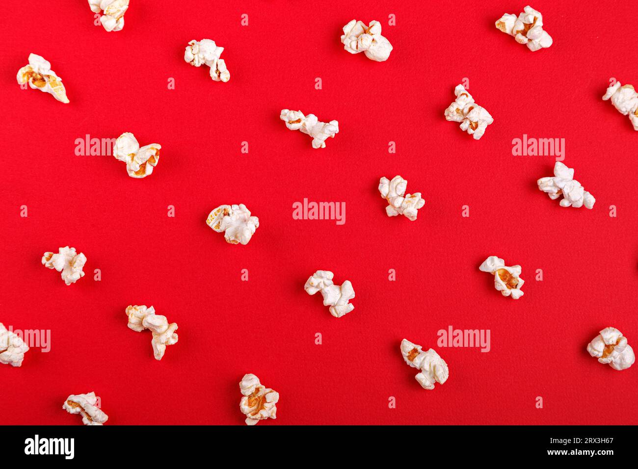 popcorn macro on a red background close-up Stock Photo - Alamy