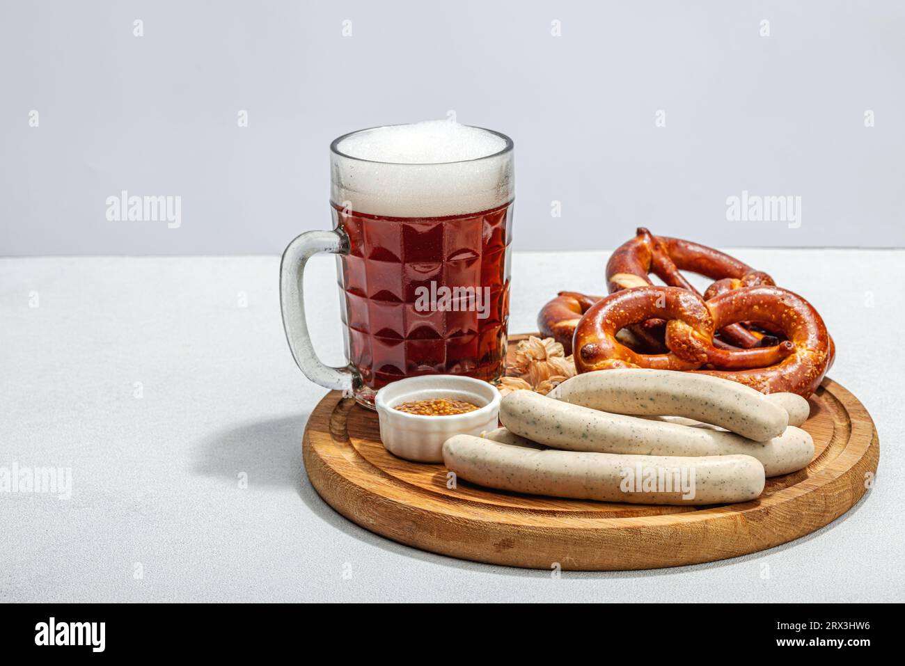 Traditional Oktoberfest set. Pretzels, beer, weisswurst with mustard ...