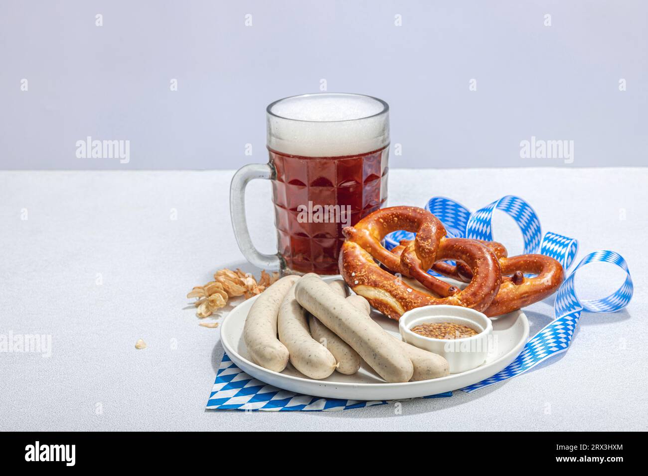 Traditional Oktoberfest set. Pretzels, beer, weisswurst with mustard ...