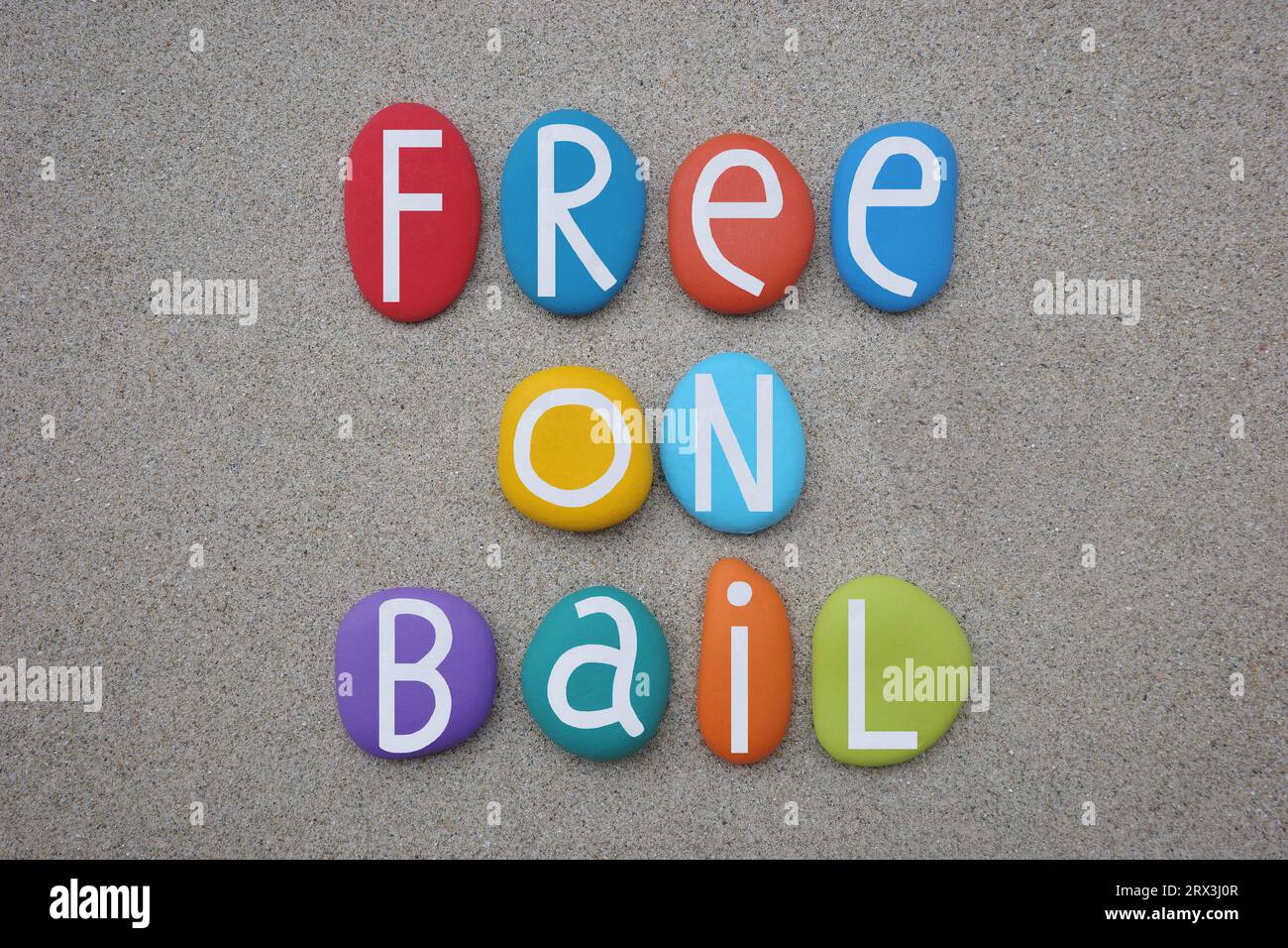 Free on Bail, creative text composed with multi colored stone letters ...