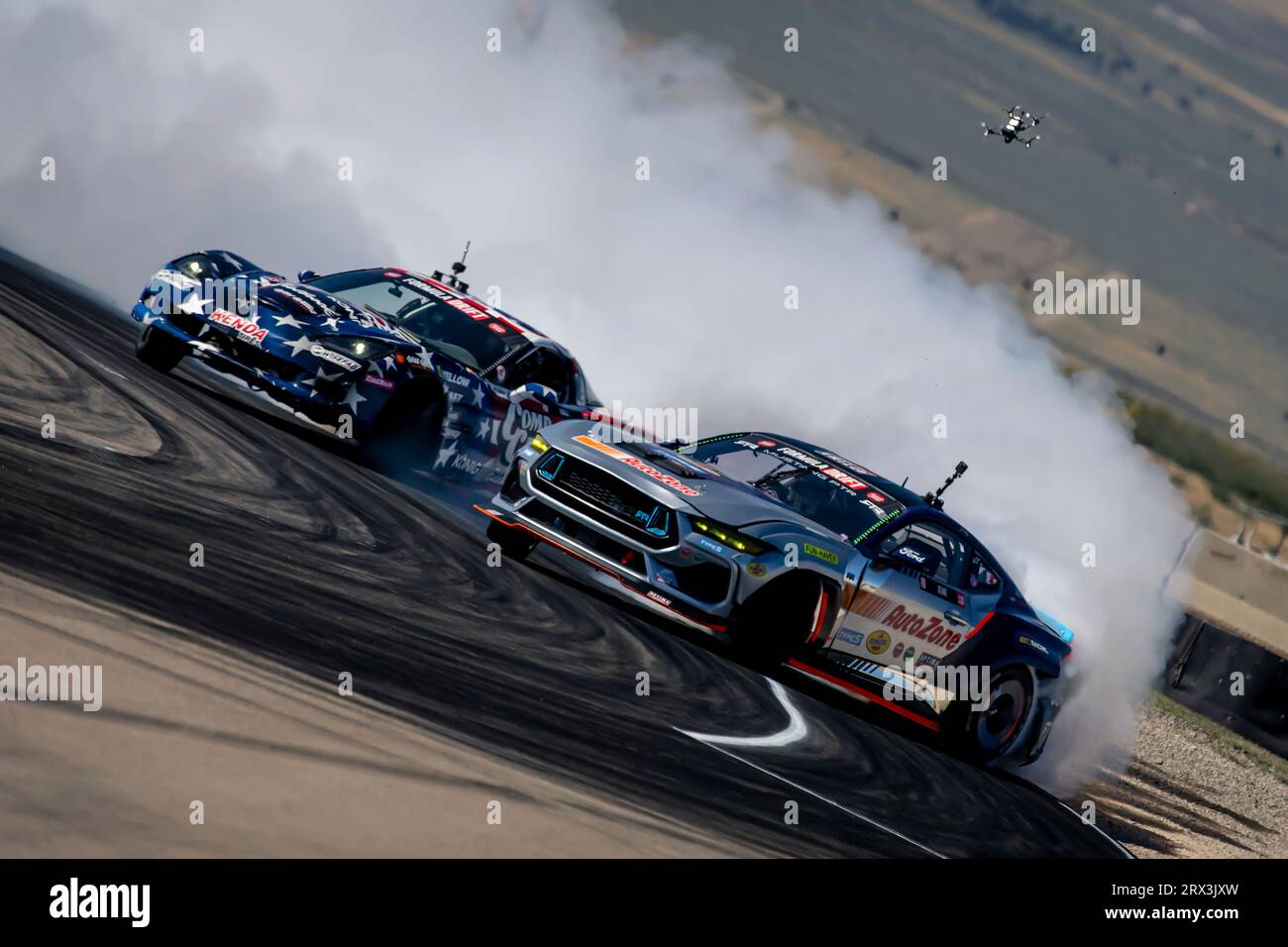 James Deane (right) and Taylor Hull (left) race their drift cars during ...