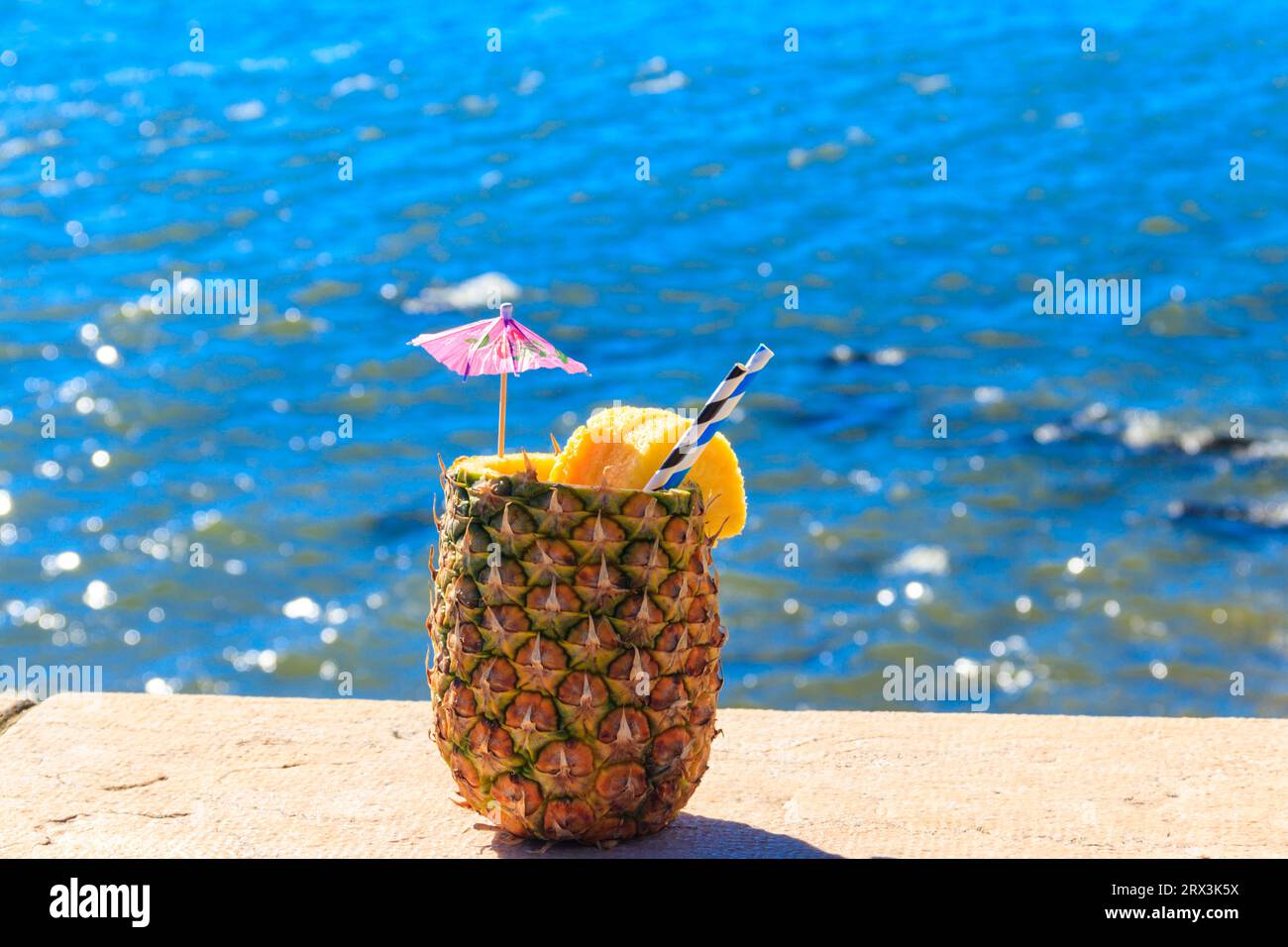 Tropical Pina Colada cocktail on the background of sea or ocean ...