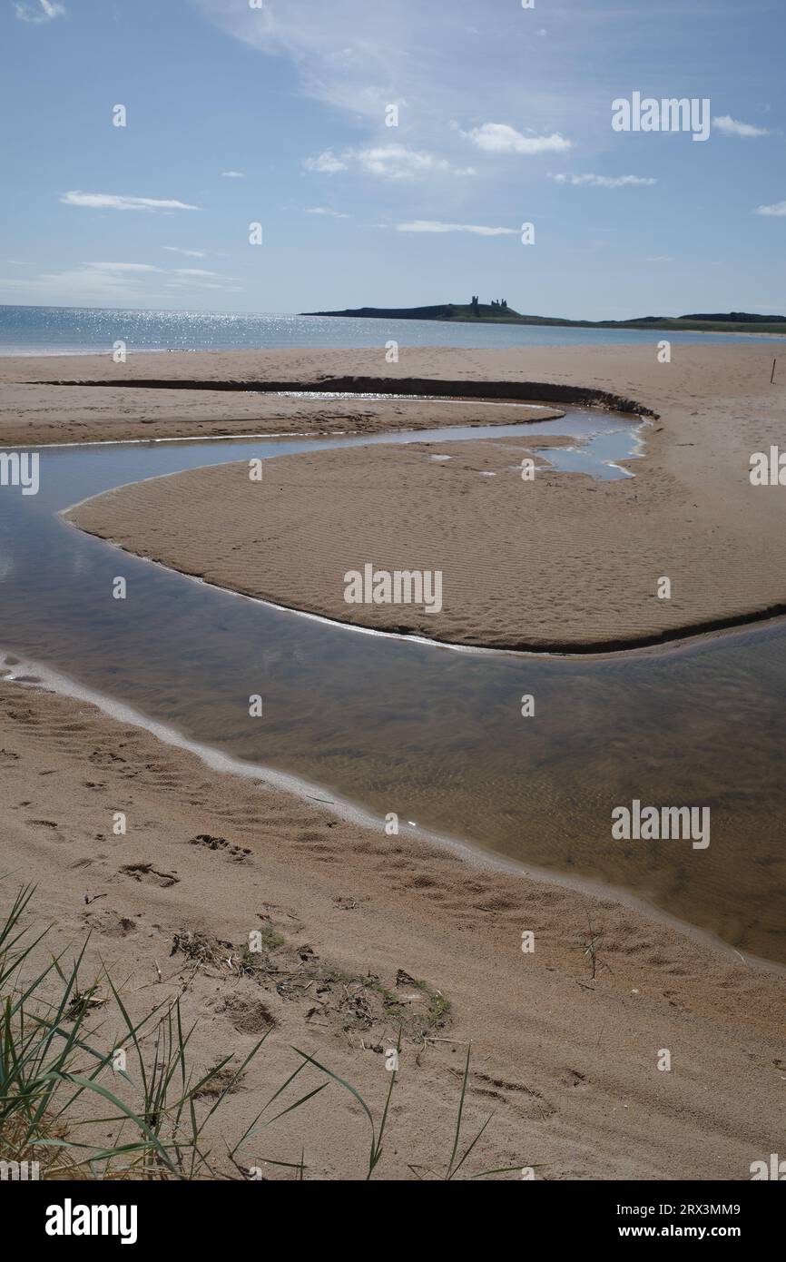 Low Newton, UK - 13 July, 2023: Views of Dunstanburgh castle and the ...