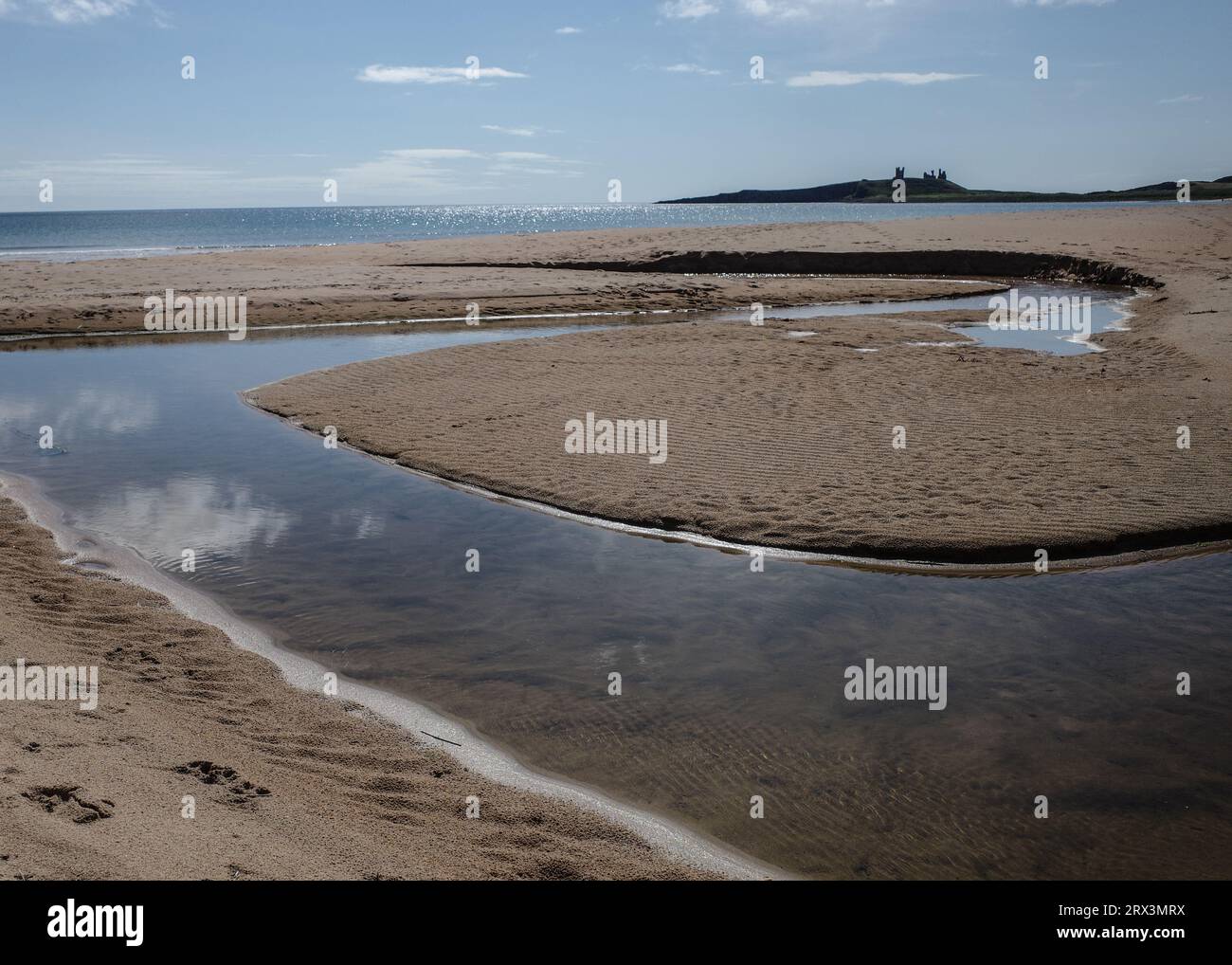 Low Newton, UK - 13 July, 2023: Views of Dunstanburgh castle and the ...