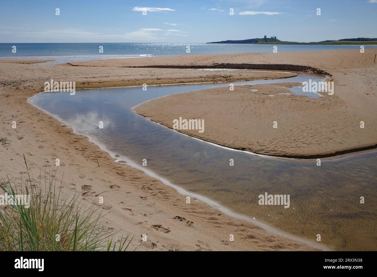 Low Newton, UK - 13 July, 2023: Views of Dunstanburgh castle and the ...