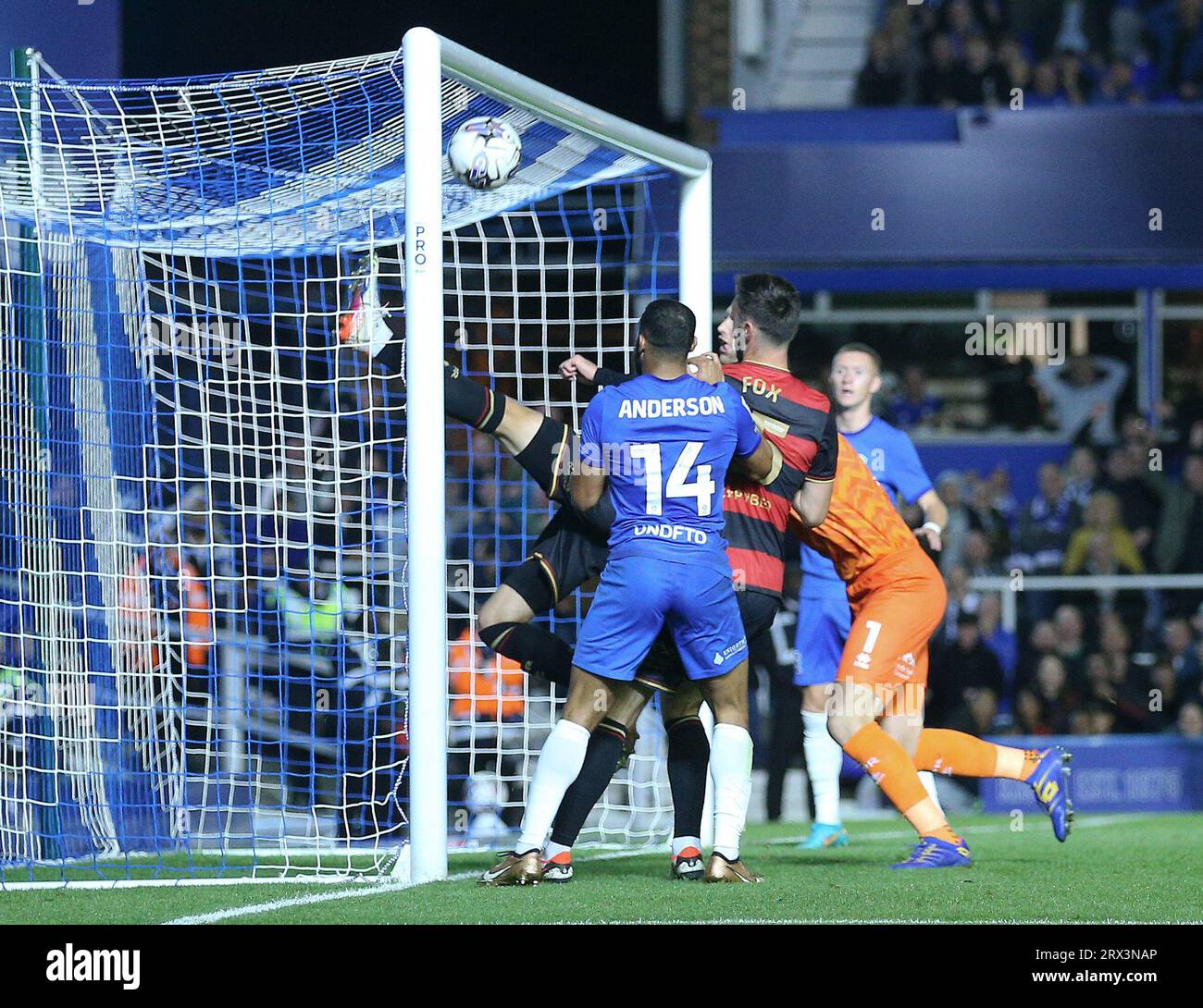 Queens Park Rangers' Steve Cook (hidden) clears the ball off the line ...