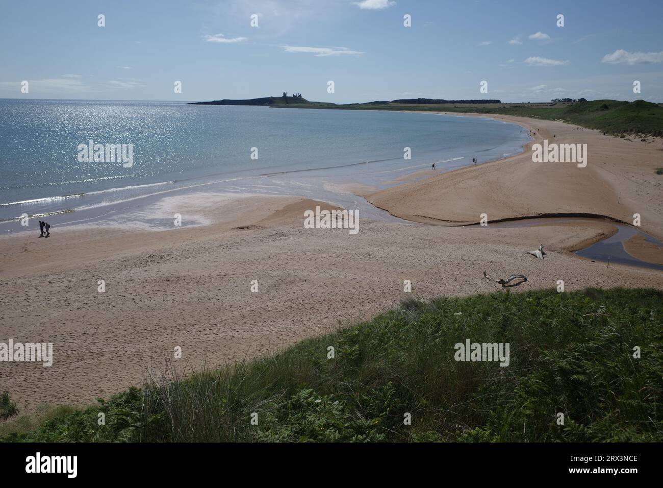 Low Newton, UK - 13 July, 2023: Views of Dunstanburgh castle and the ...