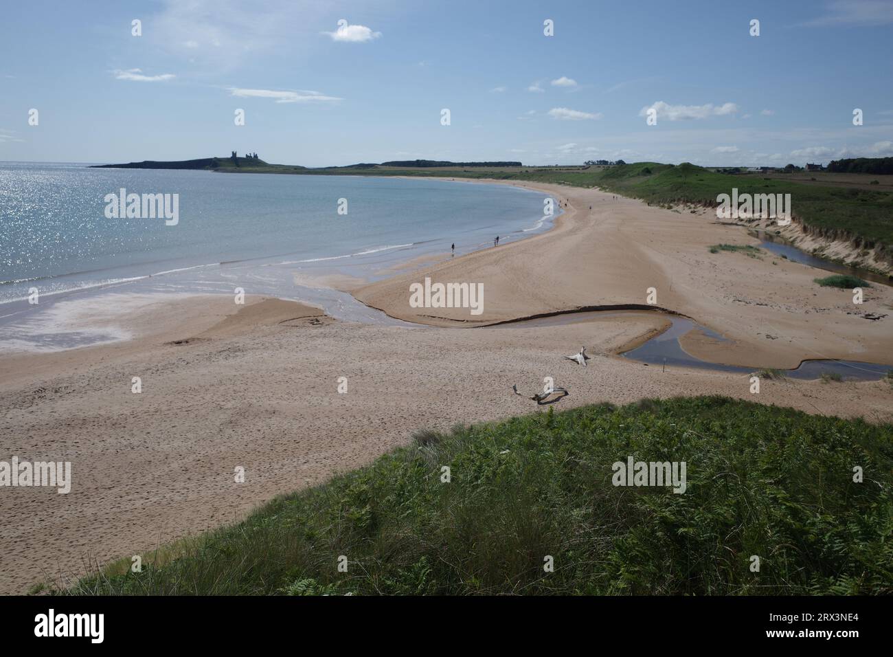 Low Newton, UK - 13 July, 2023: Views of Dunstanburgh castle and the ...