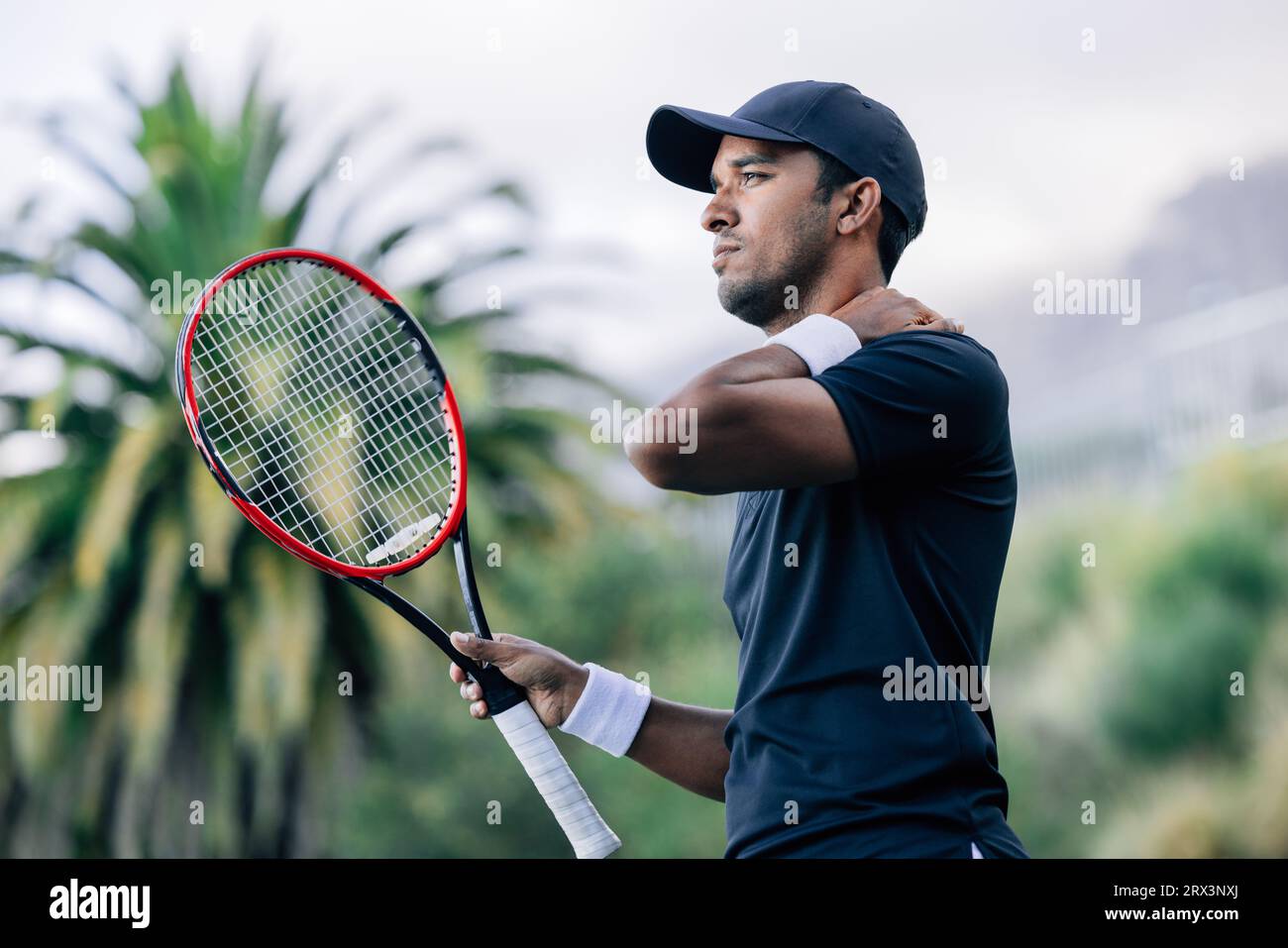 Professional tennis player touching his neck during a match Stock Photo ...
