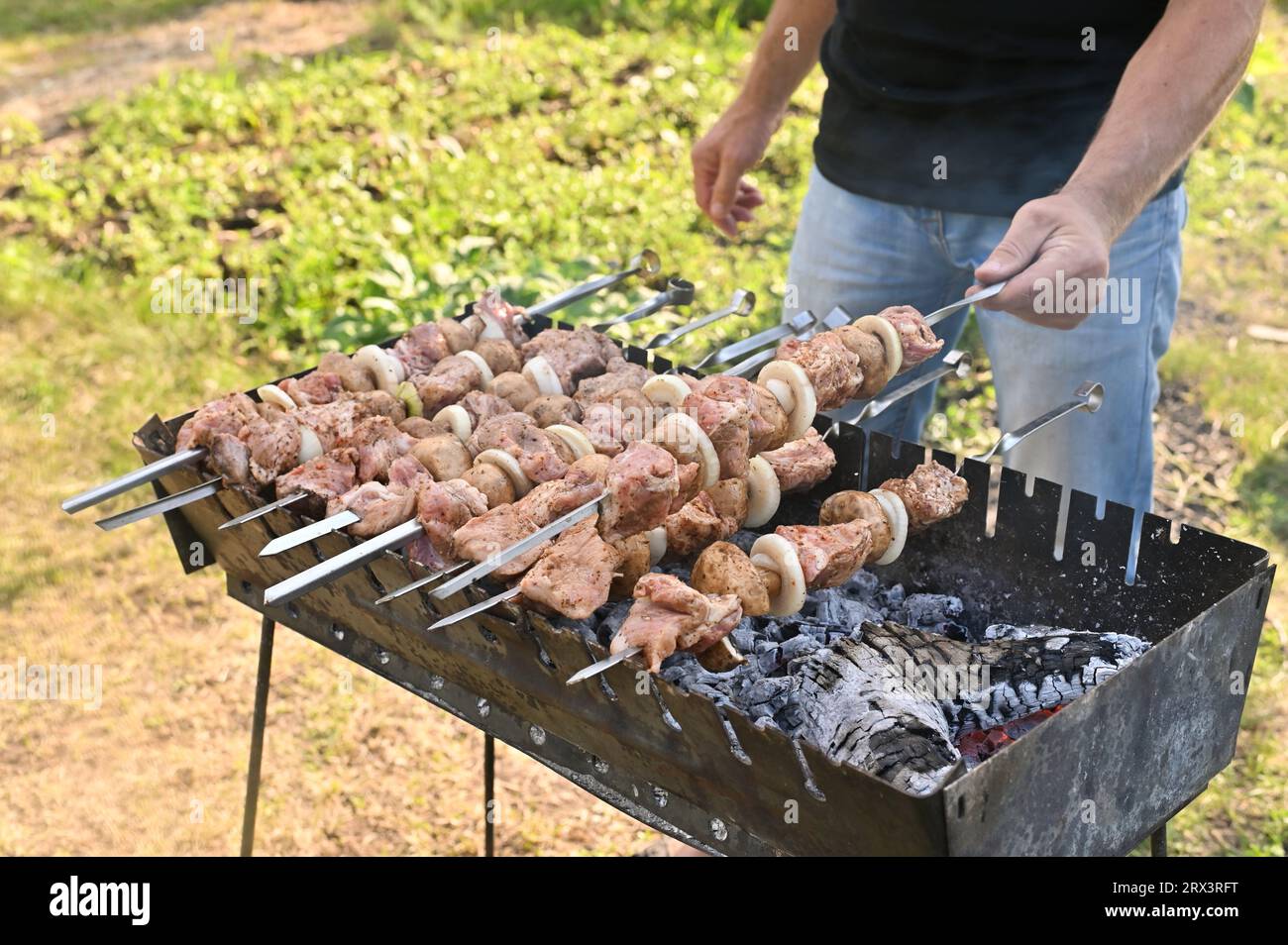 Cook turns grill meat on hi-res stock photography and images - Alamy