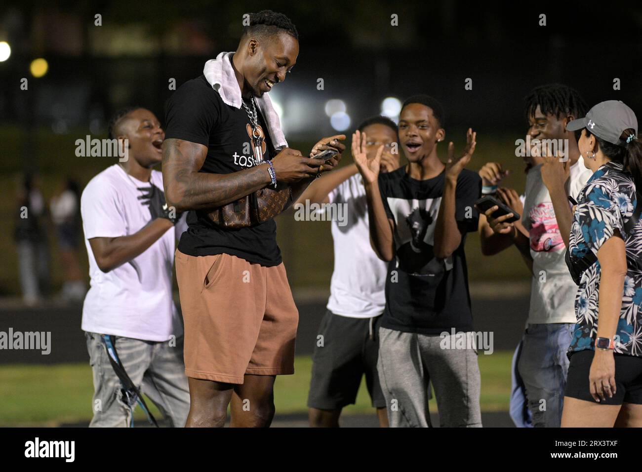 NBA basketball player Dwight Howard, and his son, Braylon Howard, left ...