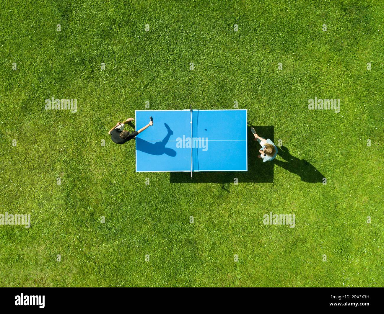 Aerial view people playing ping pong match outdoor. Top view two boys ...