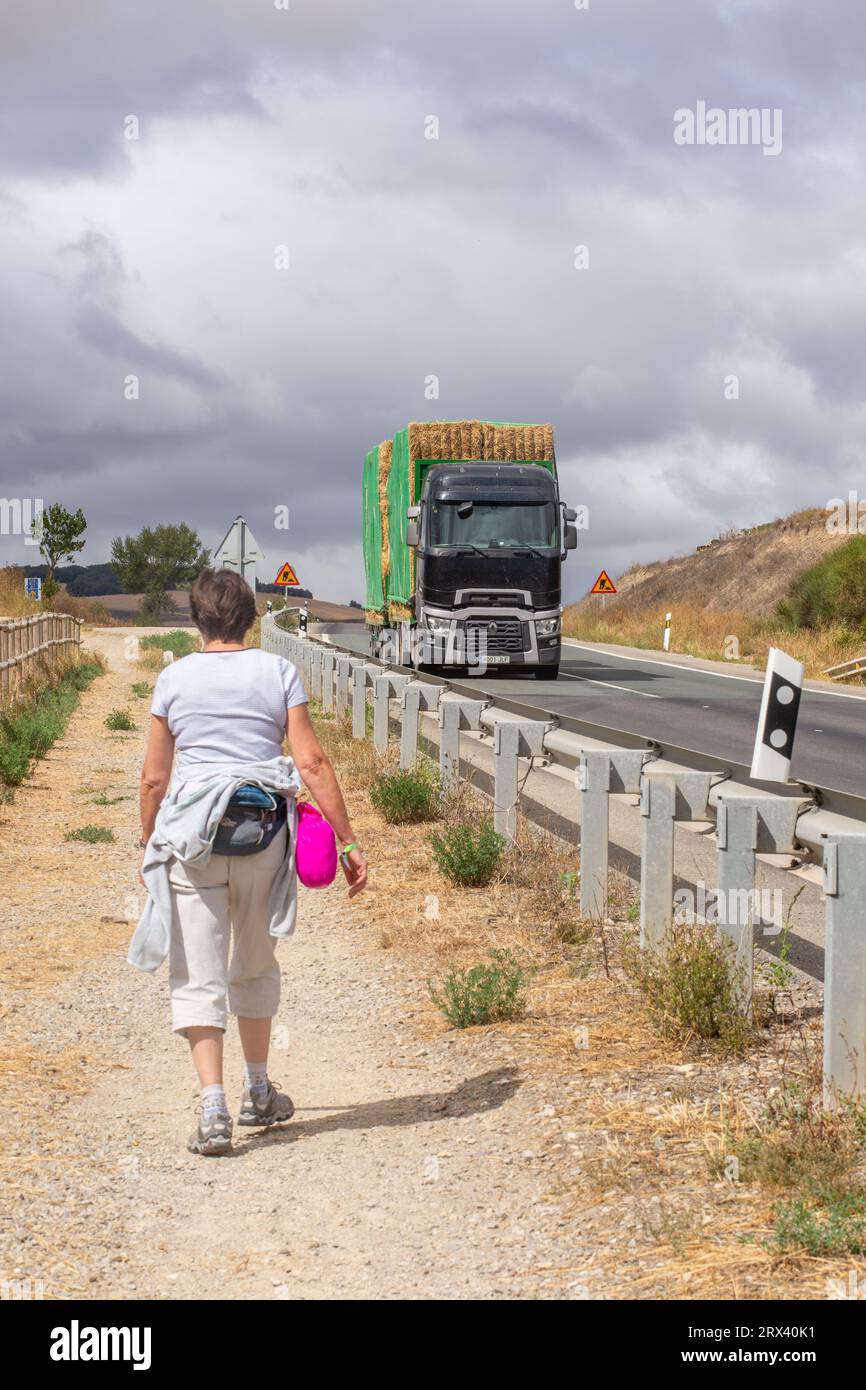 Pilgrims walking the Camino de Santiago pilgrimage route, the way of St ...