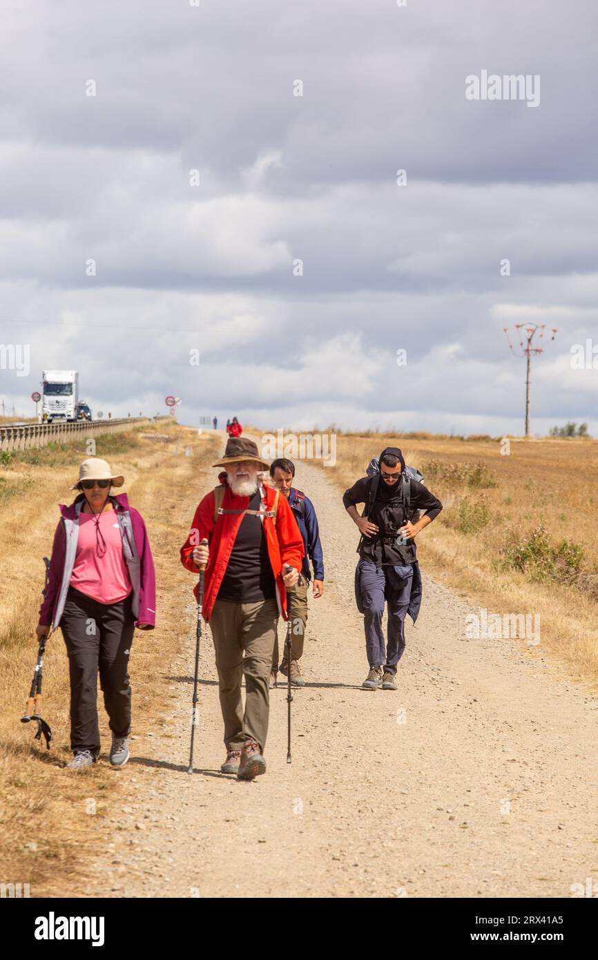 Pilgrims walking the Camino de Santiago pilgrimage route, the way of St ...