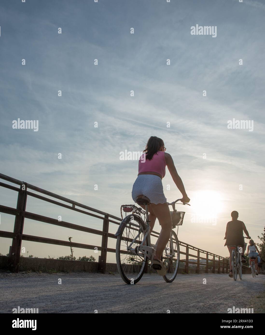 Boy girl bike sunset hi-res stock photography and images - Alamy