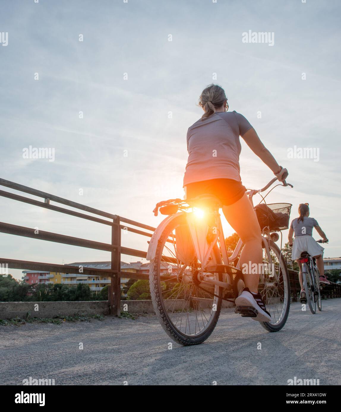 Boy girl bike sunset hi-res stock photography and images - Alamy