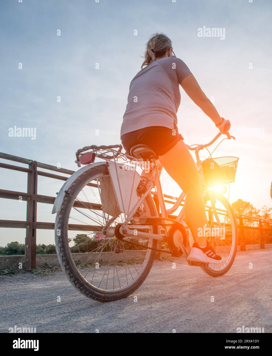 Boy girl bike sunset hi-res stock photography and images - Alamy