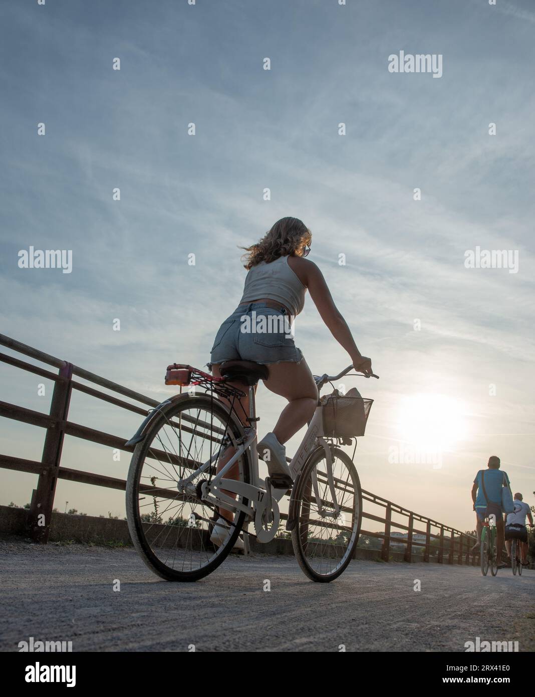 Boy girl bike sunset hi-res stock photography and images - Alamy