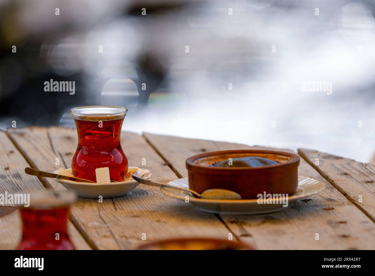 Turkish tea and rice pudding on the wood table Stock Photo - Alamy