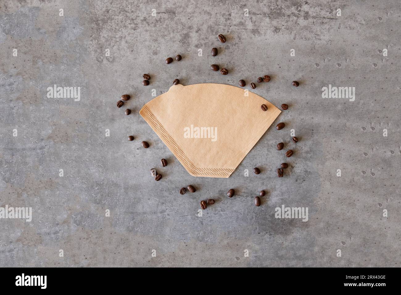 coffee paper filter on grey background with coffee beans around Stock ...