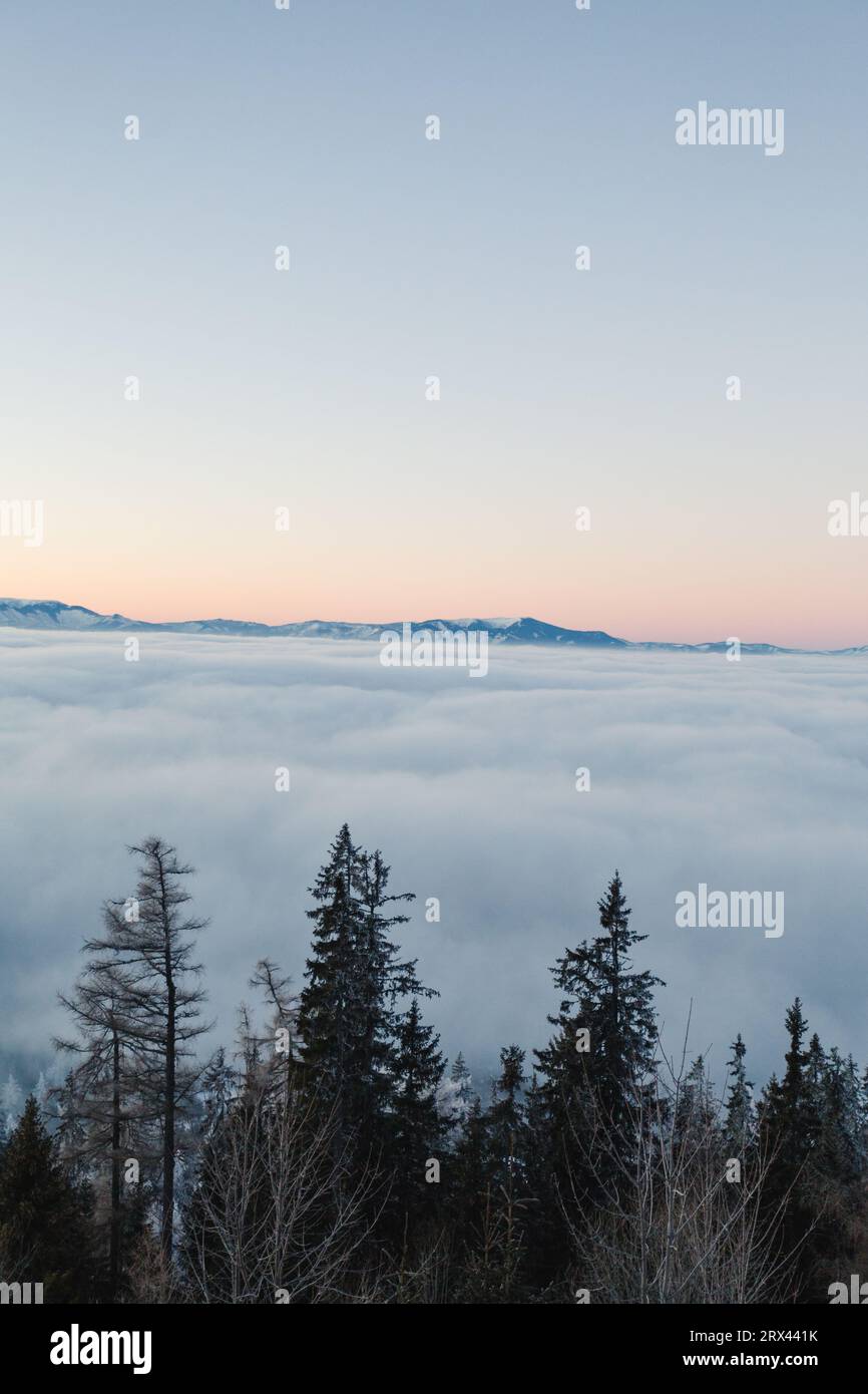 Amazing inversion over the valley with big snowy mountains on backround ...