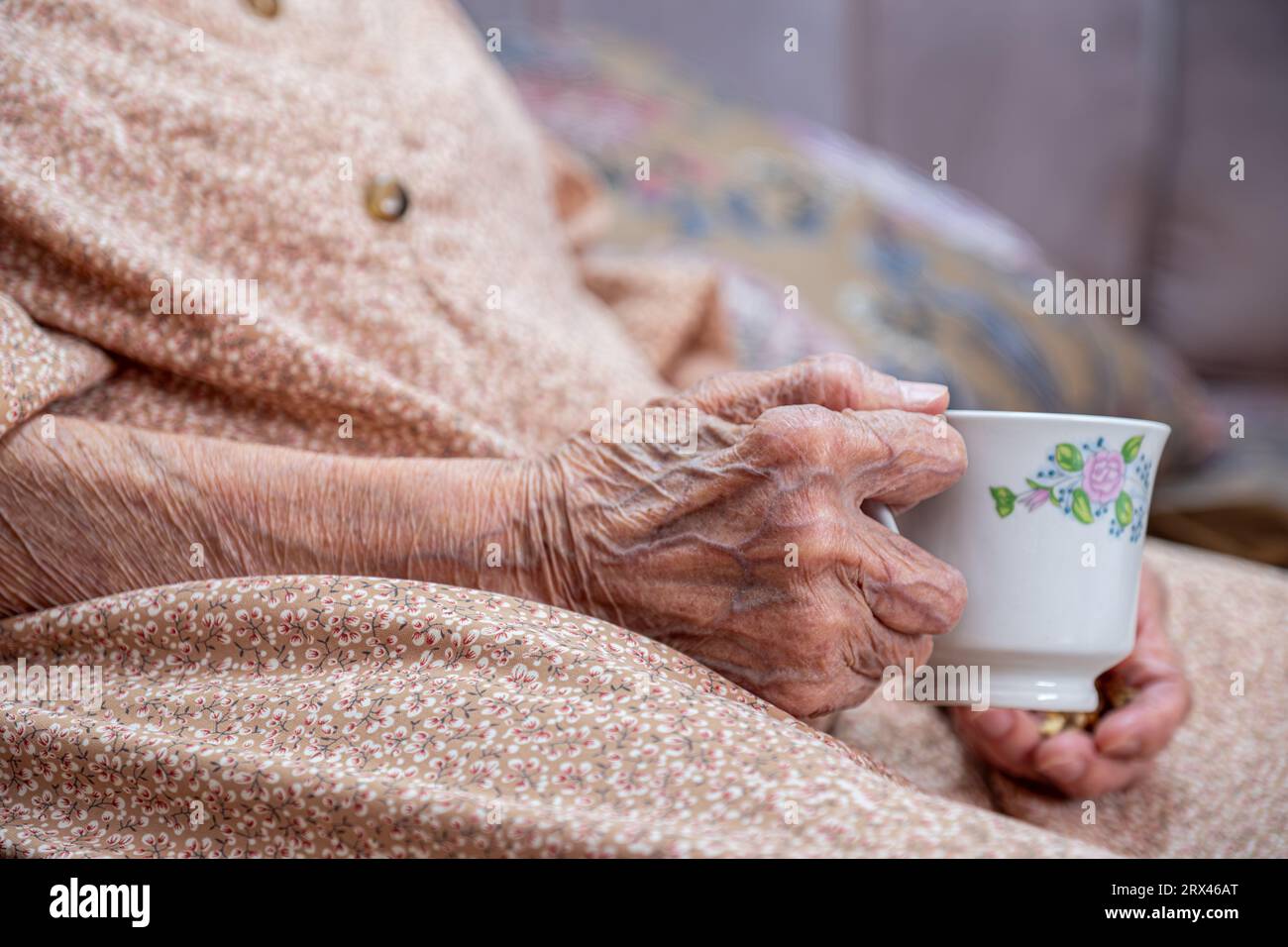 Old woman drinking coffee with smile on her face Stock Photo - Alamy
