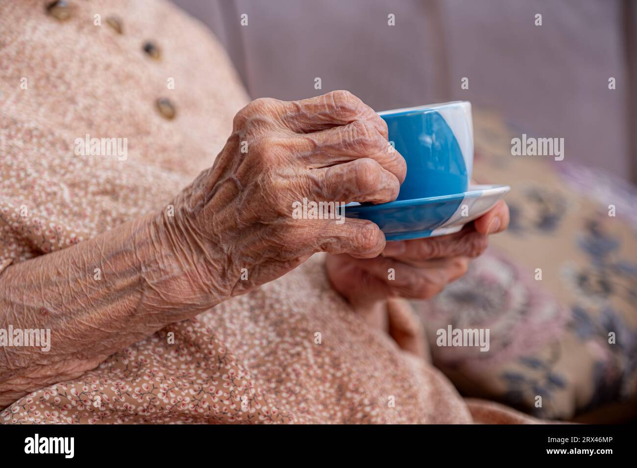Old woman drinking coffee with smile on her face Stock Photo - Alamy