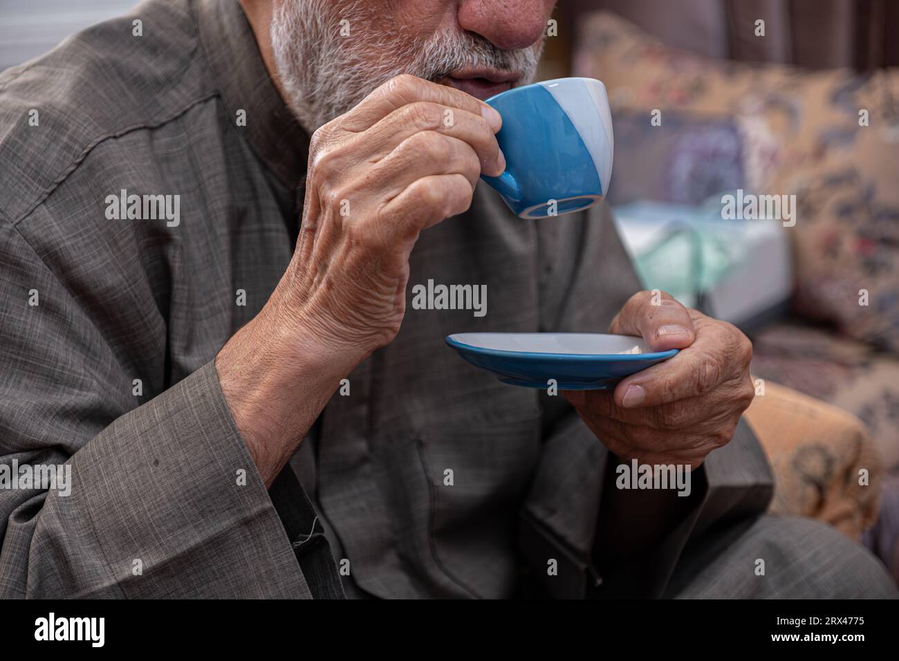 Old man drinking coffee with smile on his face Stock Photo - Alamy