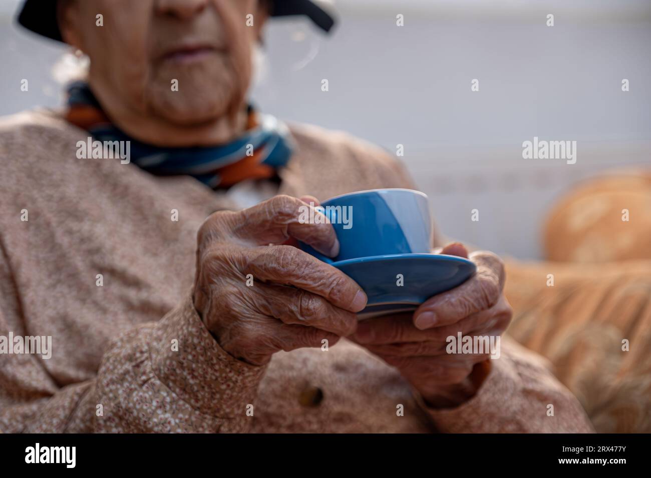 Old woman drinking coffee with smile on her face Stock Photo - Alamy