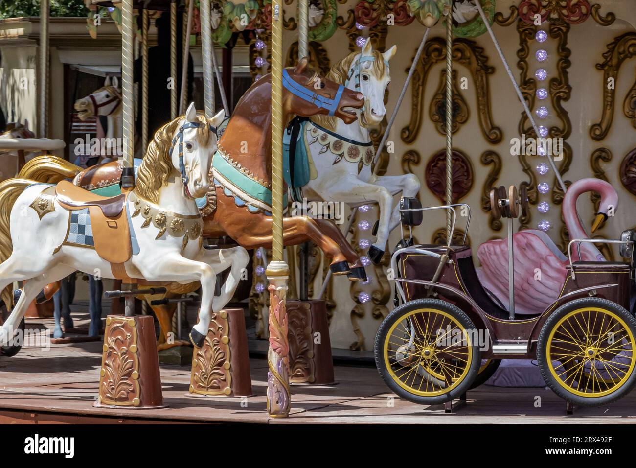 Close up of a brightly coloured old fashioned carousel Stock Photo - Alamy