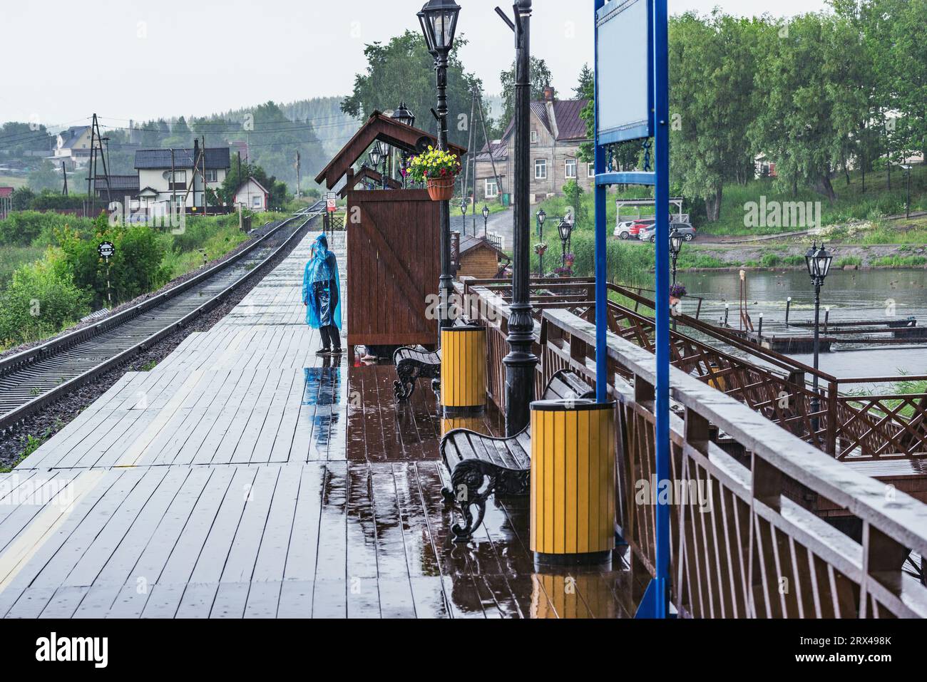 Wet wooden railway platform after rain Stock Photo - Alamy